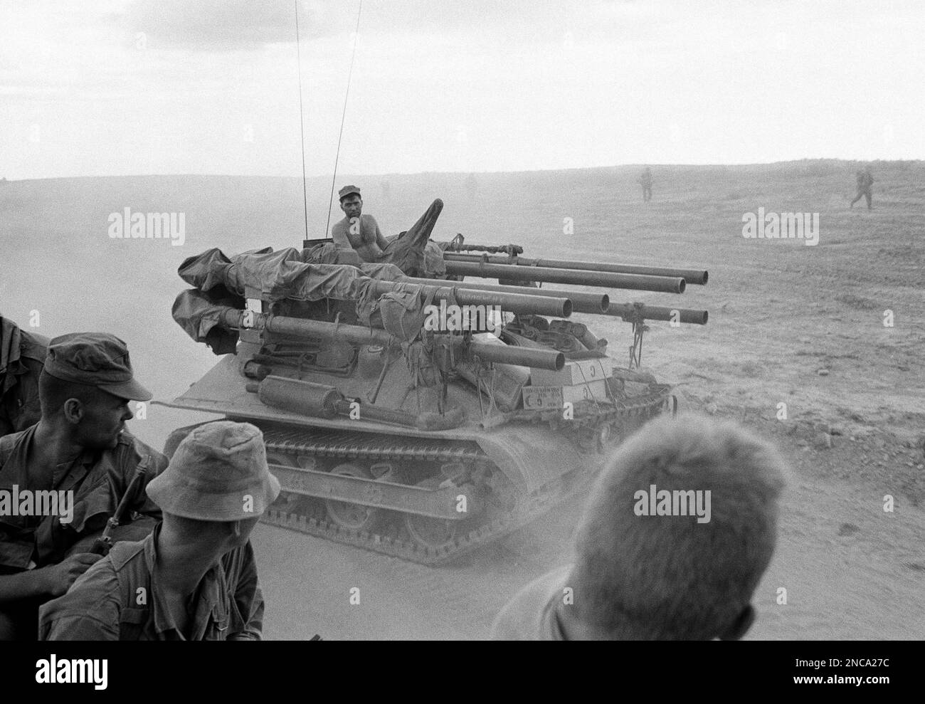 Marines turn to watch a tracked Ontos (Greek for Monster) rumble past ...
