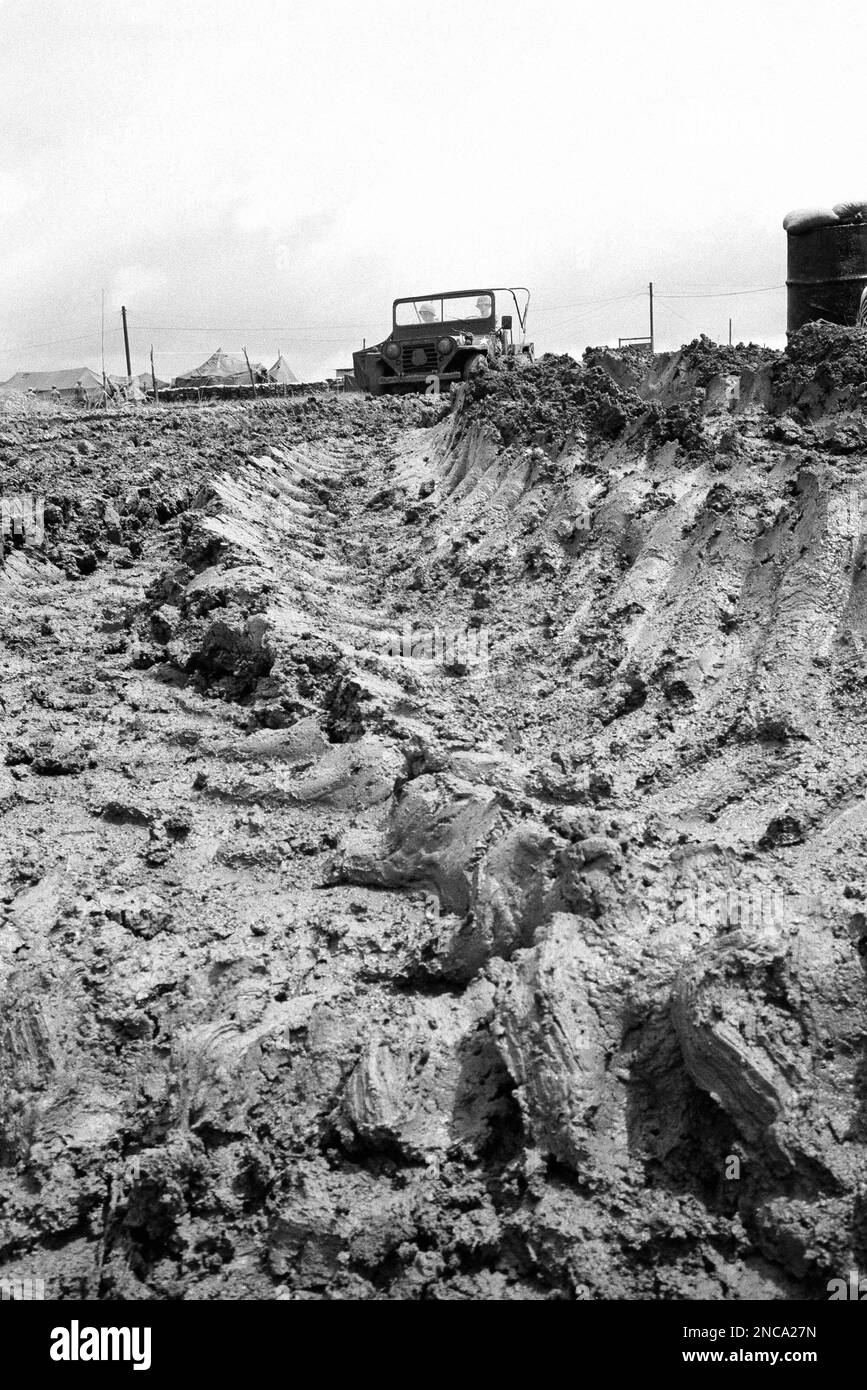 Mud, the ever present enemy of the GI, is vividly shown by his muddy ...