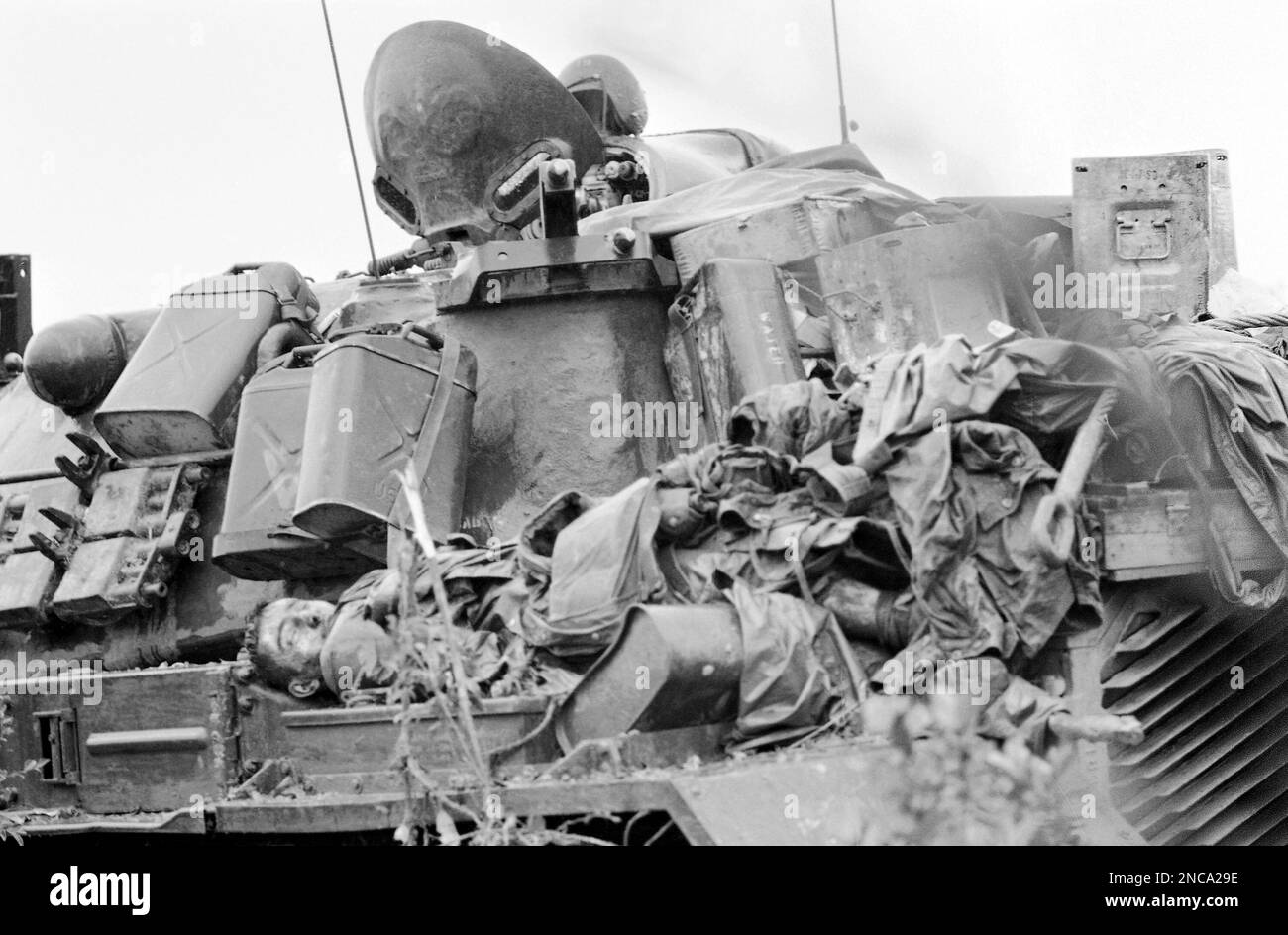 Bodies of dead U.S. marines are tied on a U.S. army tank alongside ...