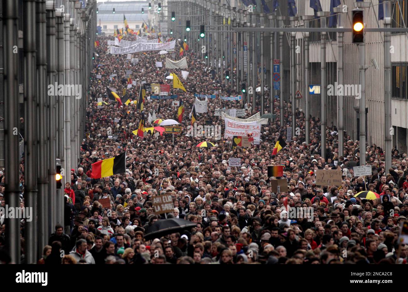 FILE - In this Sunday, Jan. 23, 3011 file photo, people march with ...