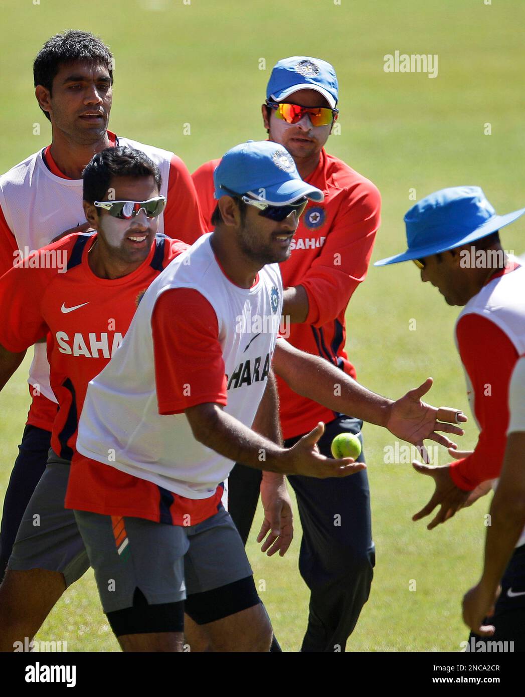 Indian cricketers, from left, Munaf Patel, Ravindra Ashwin, captain Mahendra Singh Dhoni, Suresh ...