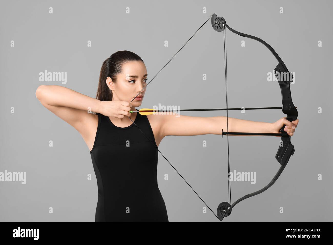 Young female archer practicing archery hi-res stock photography and ...