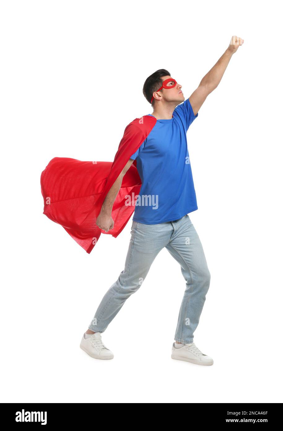 Man wearing superhero cape and mask on white background Stock Photo - Alamy