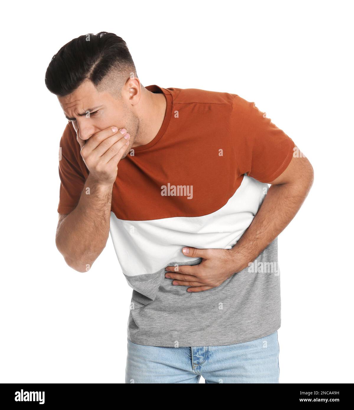 Man suffering from stomach ache and nausea on white background. Food ...