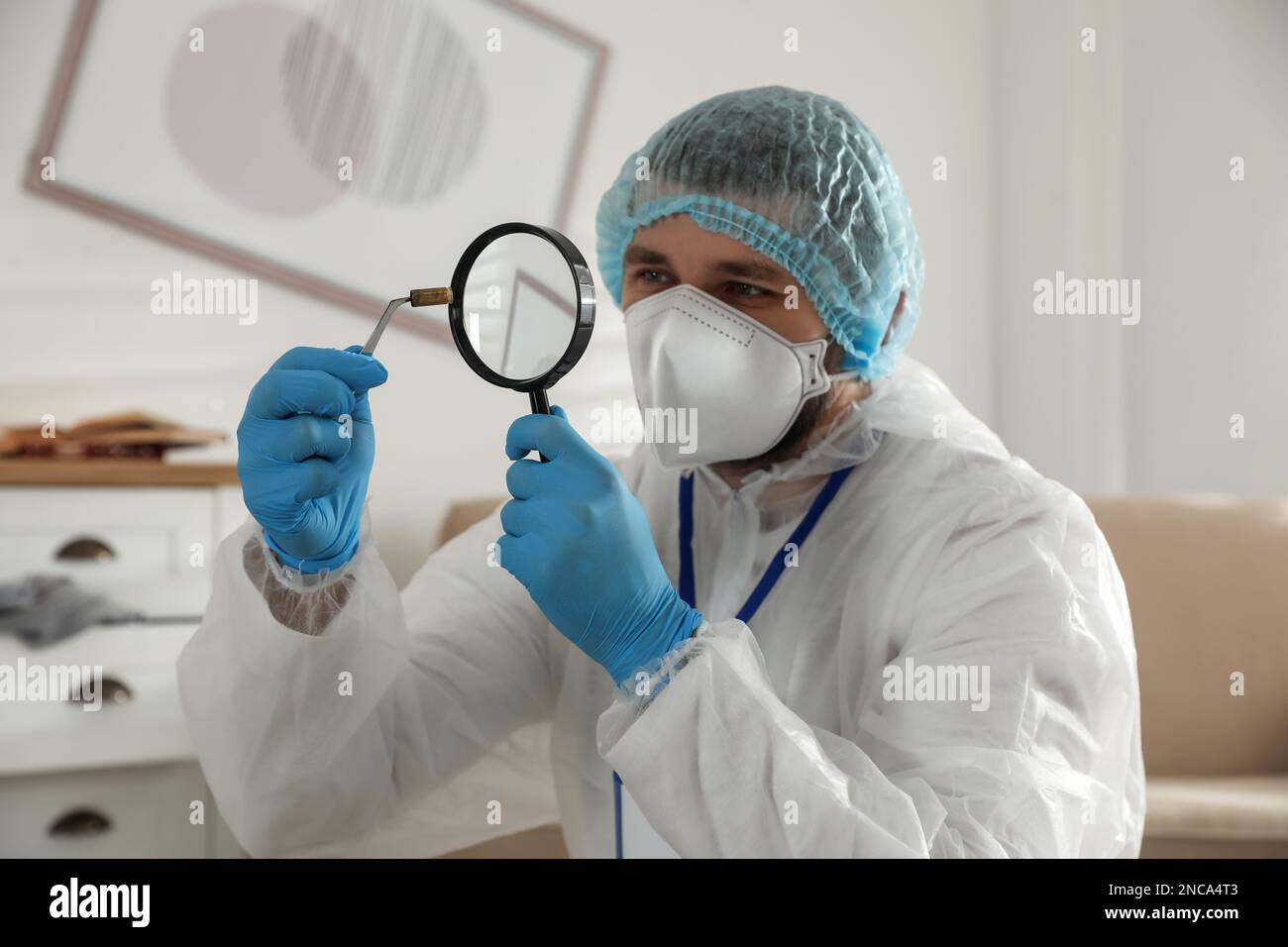 Police evidence examination detective examining hi-res stock ...