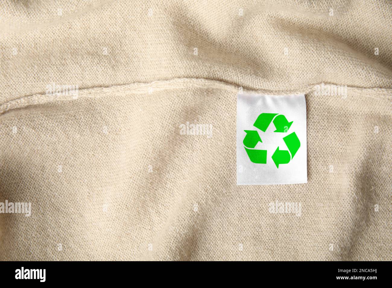 Clothing label with recycling label on cashmere sweater, closeup Stock ...