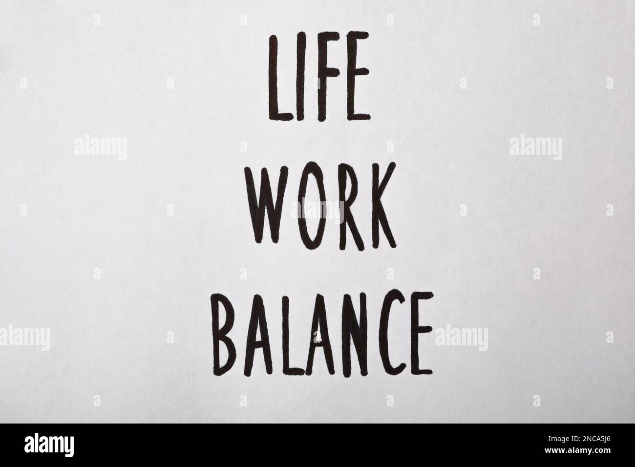Life, Work, Balance written on white background, top view Stock Photo ...