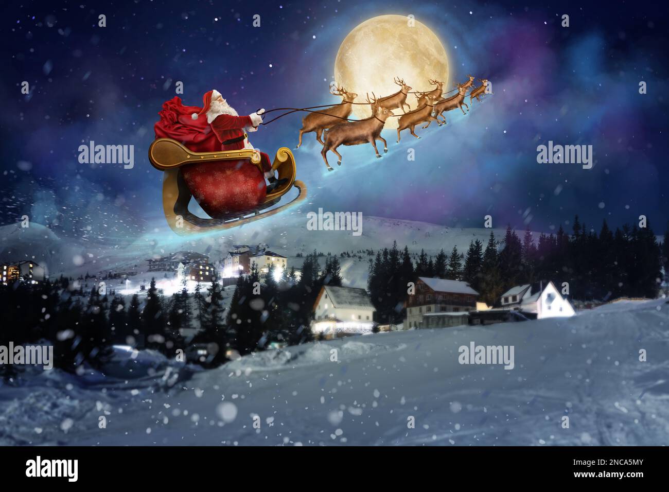 Magic Christmas eve. Santa with reindeers flying in sky on full moon night Stock Photo - Alamy
