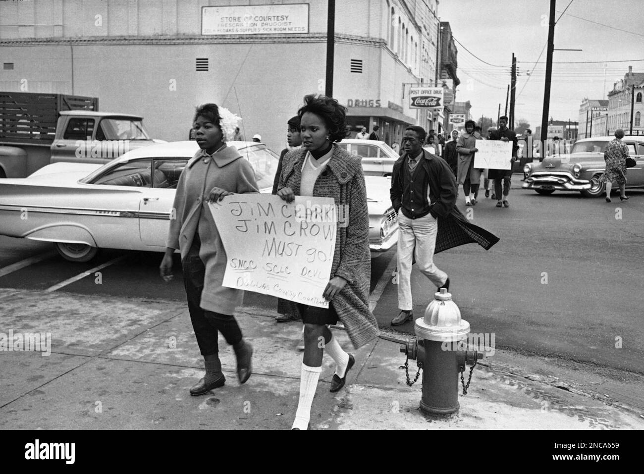 These youngsters carry signs protesting Dallas County Sheriff Jim Clark ...