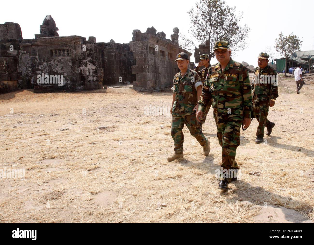 Cambodian frontline commander Gen. Chea Tara, center, walks through the ...