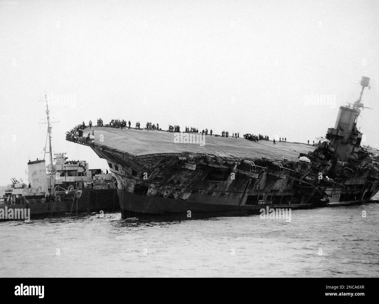Last scenes on board the sinking British aircraft carrier H.M.S. Ark Royal, showing the flight ...