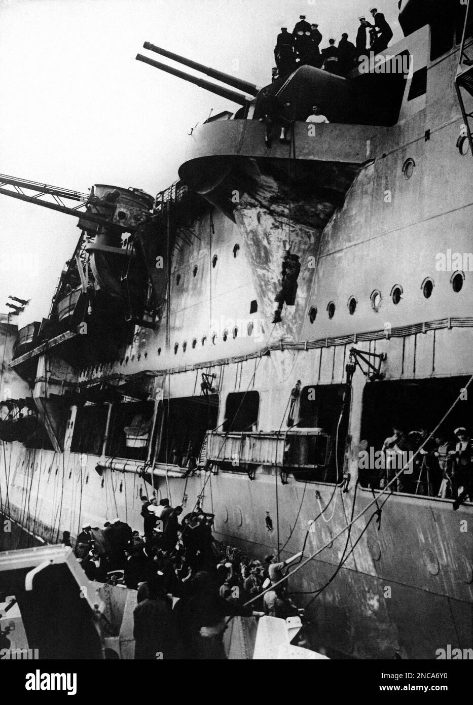 Last scenes on board the sinking British aircraft carrier H.M.S. Ark Royal, showing the flight ...