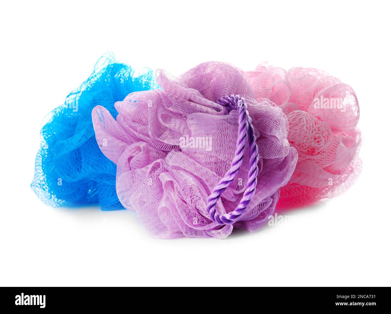 Set with new shower puffs on white background Stock Photo - Alamy