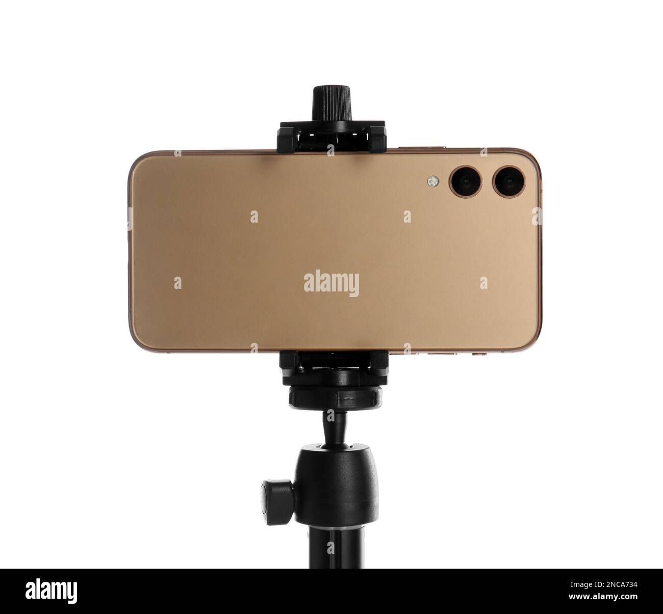 Smartphone fixed to stand on white background Stock Photo - Alamy
