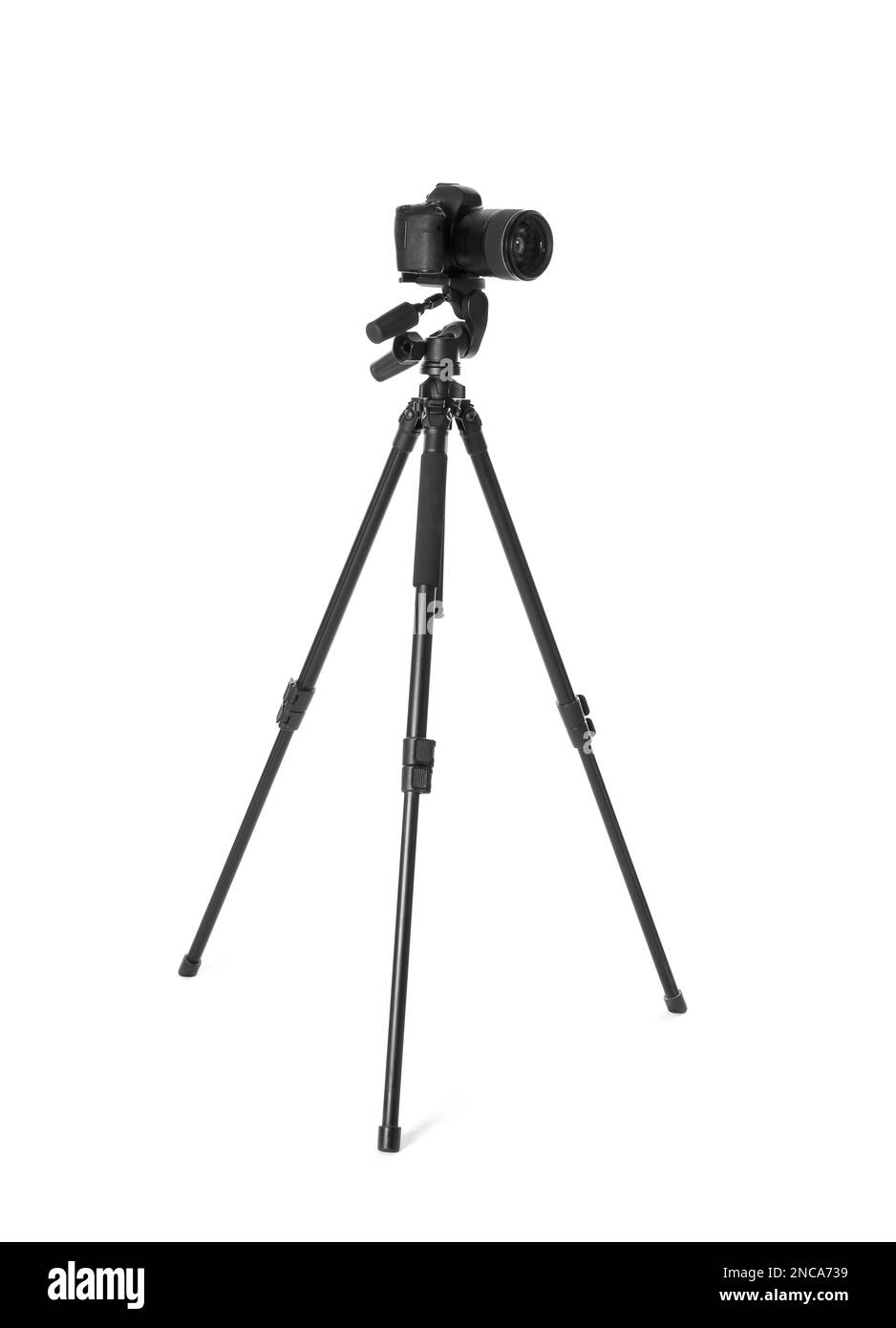 Modern tripod with camera isolated on white Stock Photo - Alamy