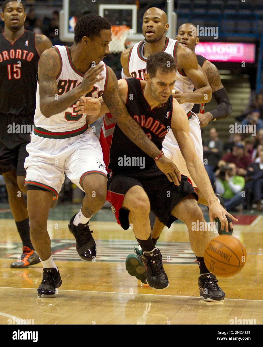 Toronto Raptors' Jose Calderon, right, drives up court against ...
