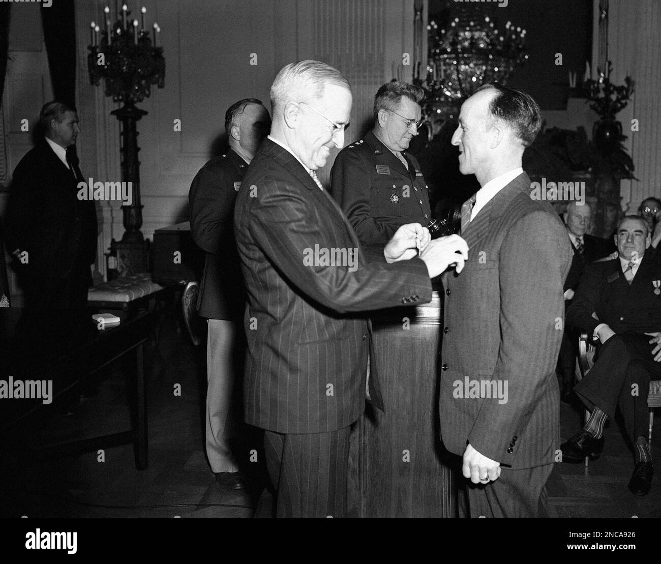 President Harry Truman, left, pins the Selective Service Medal on ...