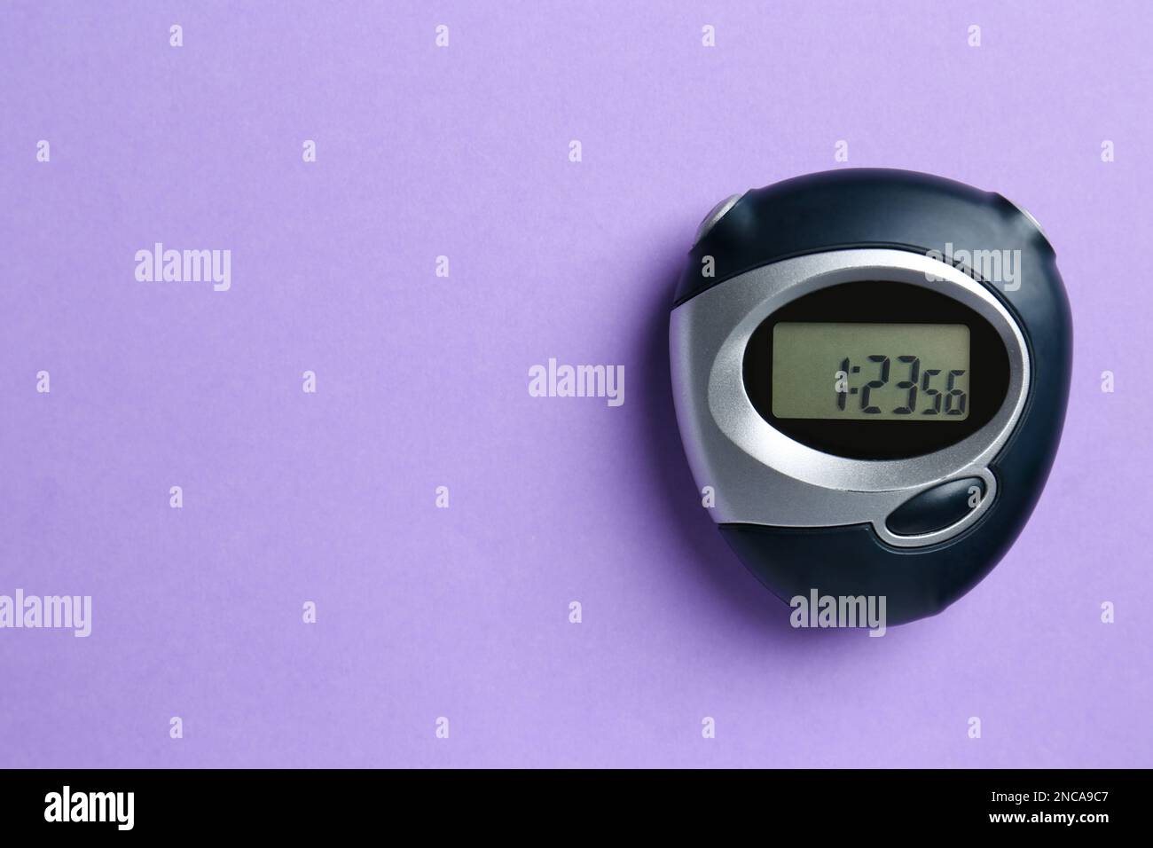 Digital timer on violet background, top view. Space for text Stock ...