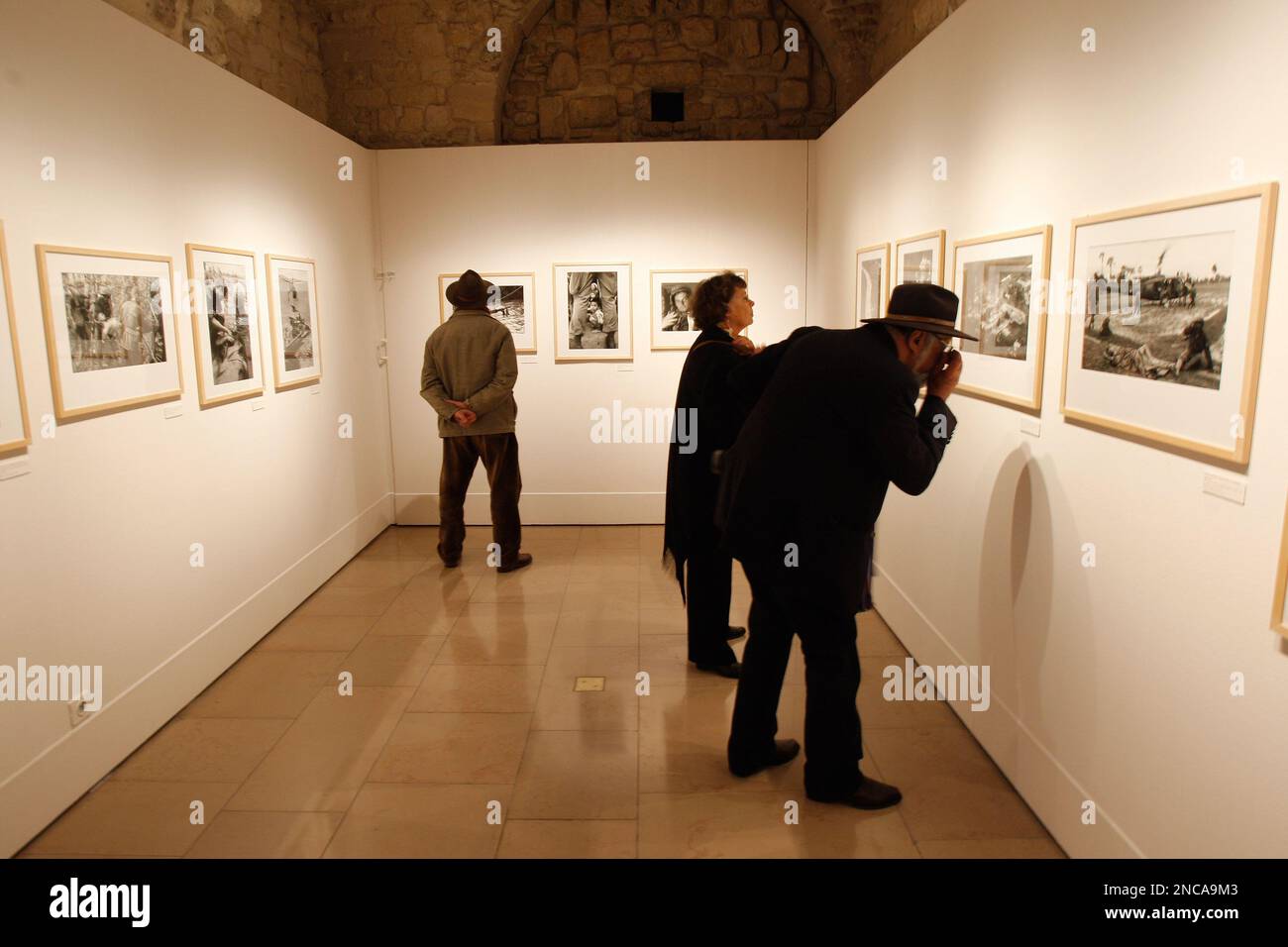 People look at the photos of the the 'Henri Huet, Vietnam' exhibition ...