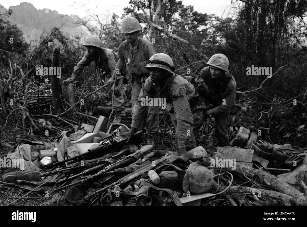 Rifles and equipment of men killed or wounded in night fighting are ...