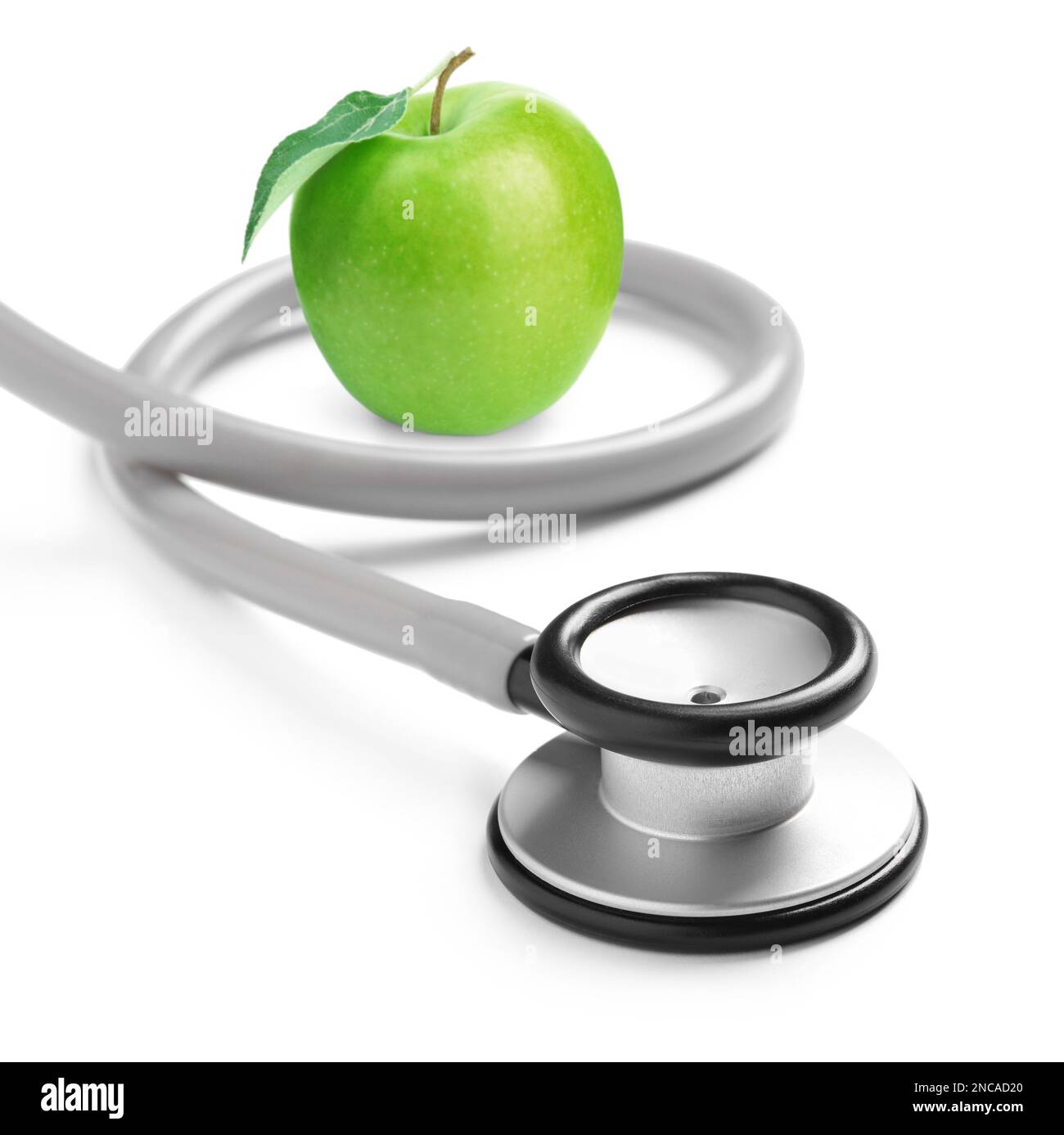 Stethoscope and green apple on white background Stock Photo - Alamy