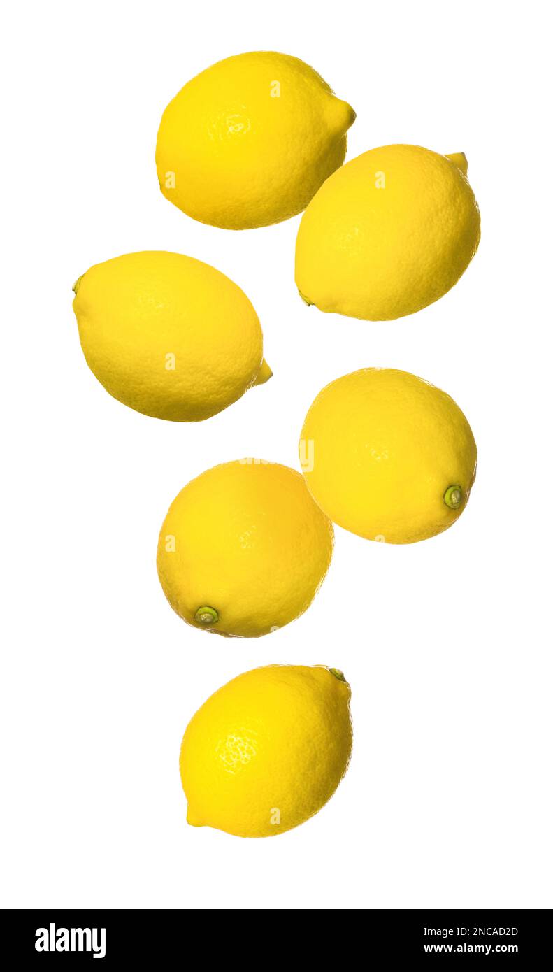 Fresh ripe lemons falling on white background Stock Photo - Alamy