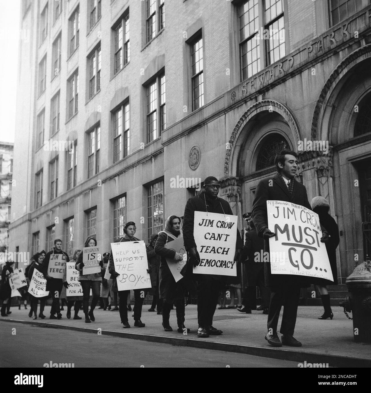Placard-carrying pickets march in front of Seward Park High School on ...