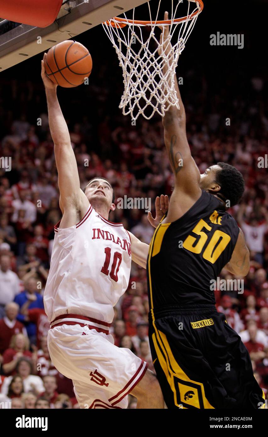 Indiana forward Will Sheehey, left, shoots under Iowa forward Jarryd ...