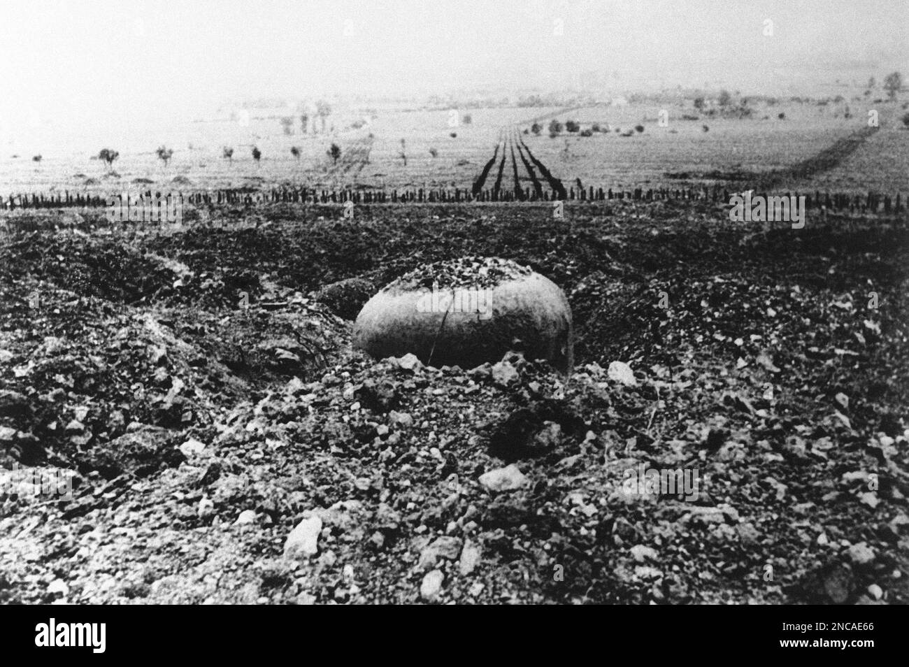 This knob-like structure surrounded by churned earth and stone, is Hill ...