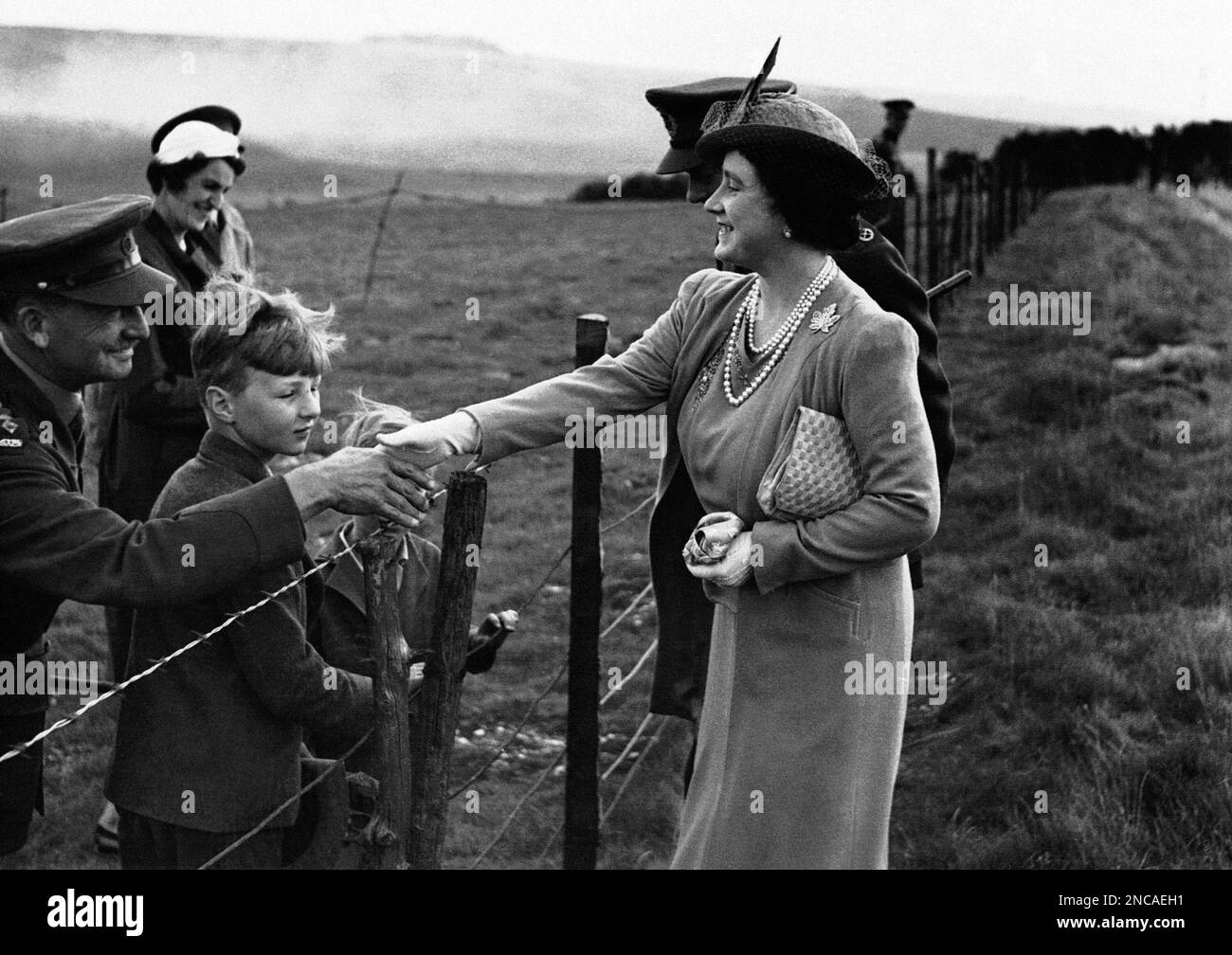 Britain's Queen Elizabeth shaking hands with an officer, during a visit ...