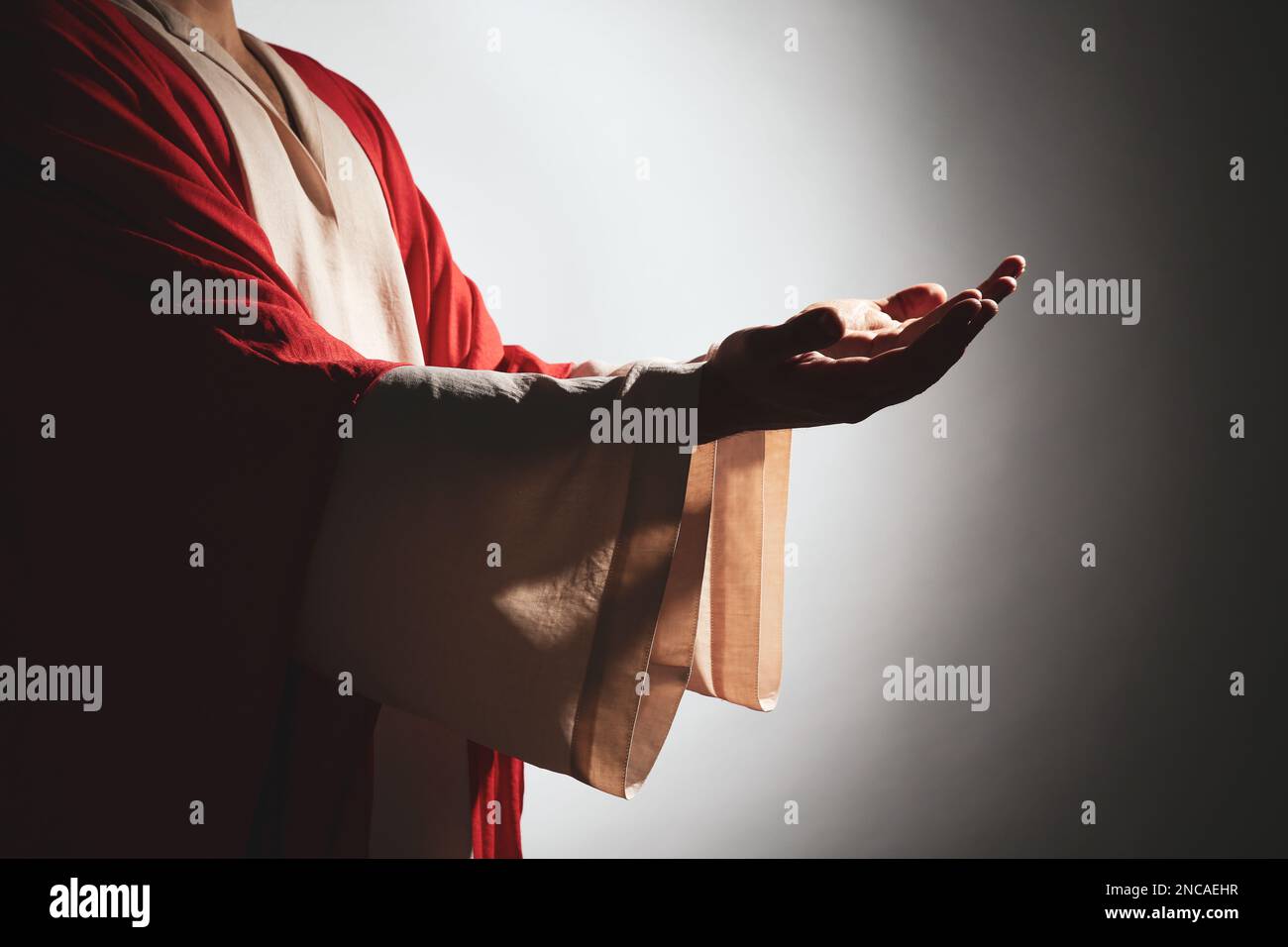 Jesus Christ reaching out his hands on grey background, closeup Stock ...