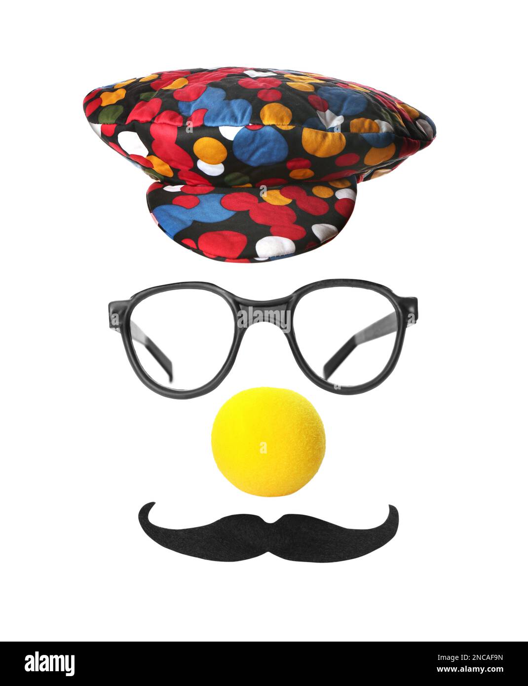 Funny clown's face made of hat, eyeglasses, foam nose and mustache on ...