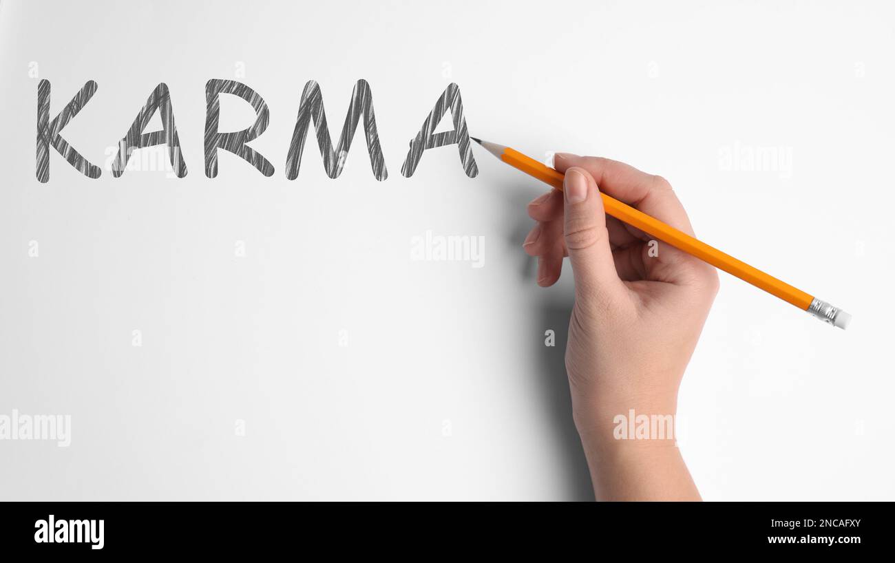 Woman writing word KARMA on white background, closeup, Banner design ...