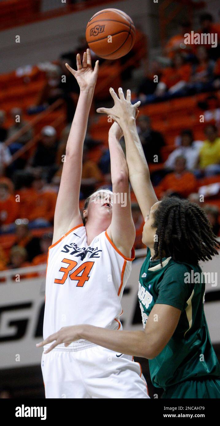 Oklahoma State center Vicky McIntyre, left, releases a shot while ...