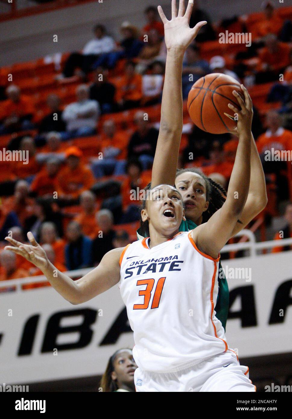 Oklahoma State center Kendra Suttles, front, shoots in front of Baylor ...