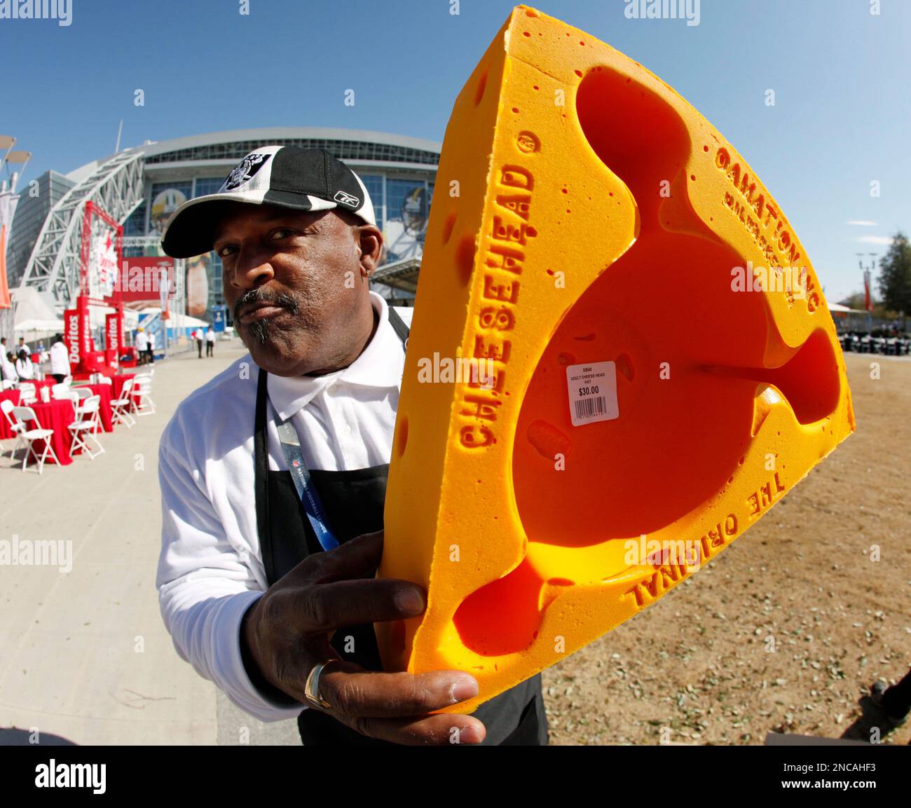 Dwight Norris sells a cheesehead outside Cowboys Stadium before the NFL ...