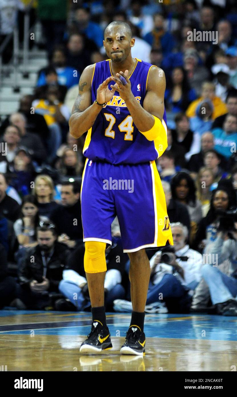 Los Angeles Lakers guard Kobe Bryant (24) claps as he walks upcourt in ...