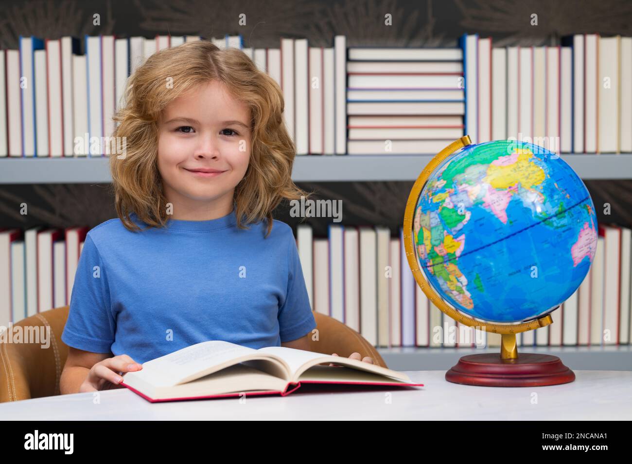 School child studying in classroom at elementary school. Kid studying ...