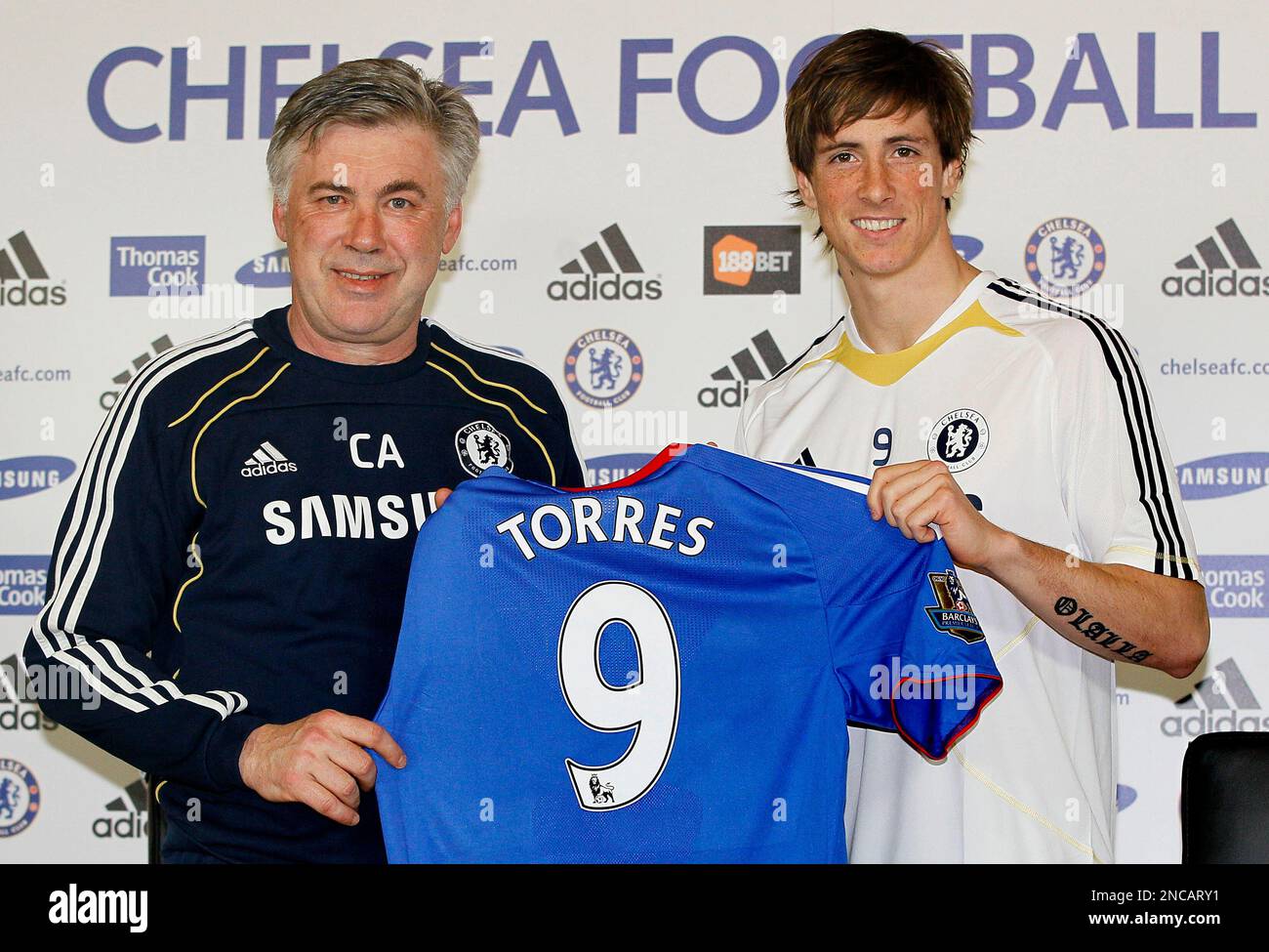 Chelsea's new signing Spain striker Fernando Torres, right, poses for a ...