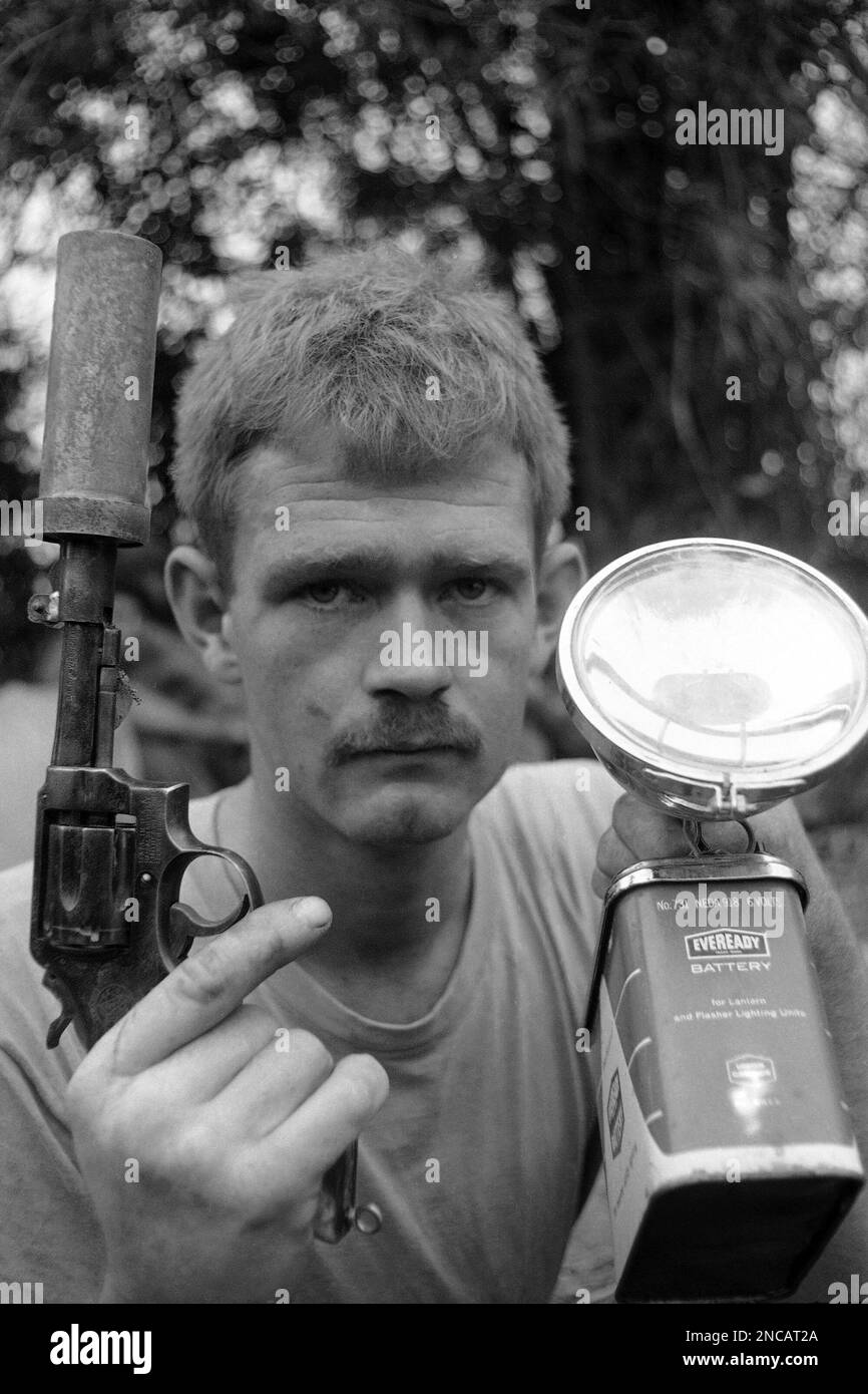 U.S. Soldier holds the needs of a “Tunnel Rat;” 38 caliber pistol with ...