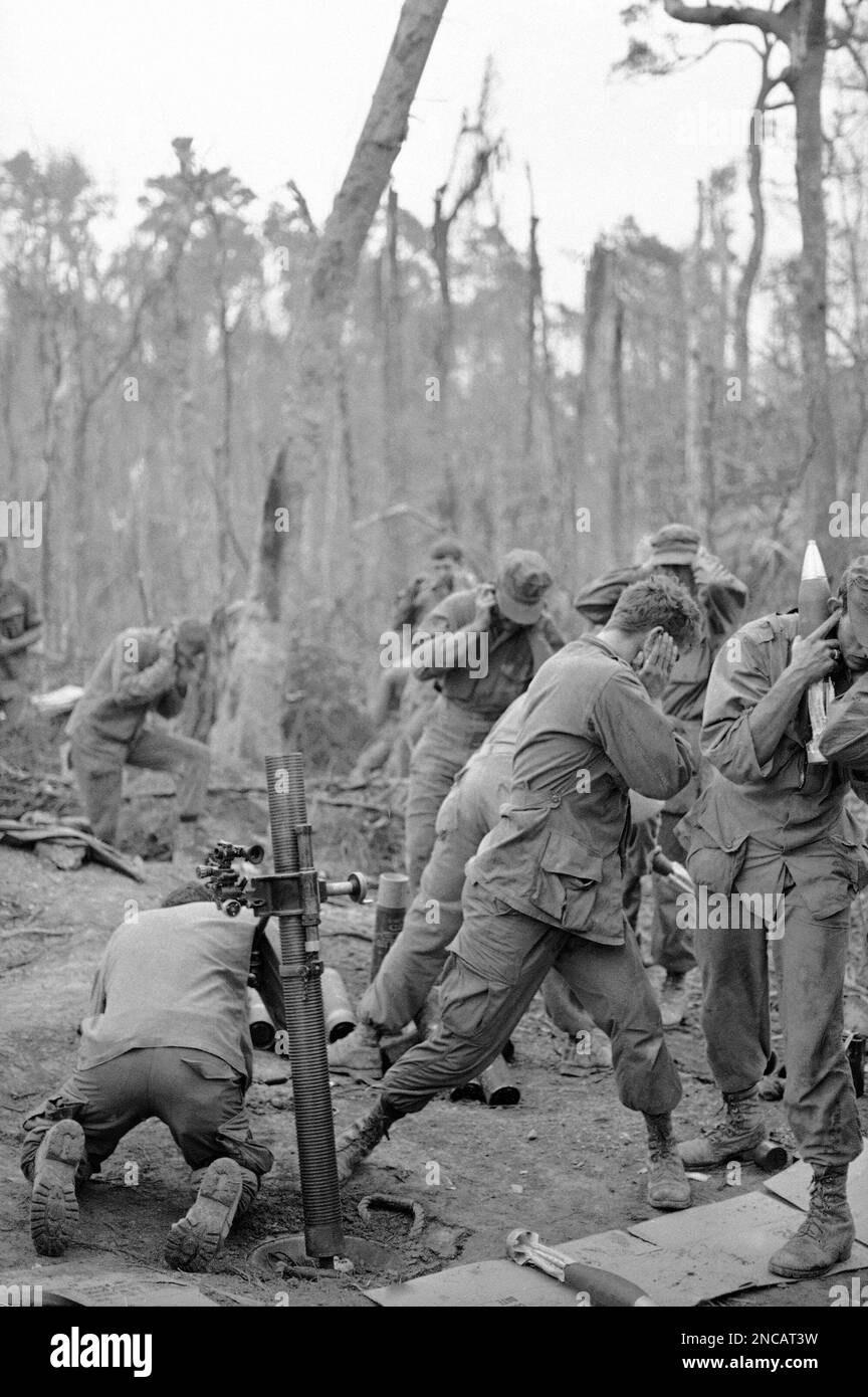 81mm mortar gun crew of the 3rd battalion, 4th marine regt. Fires into ...