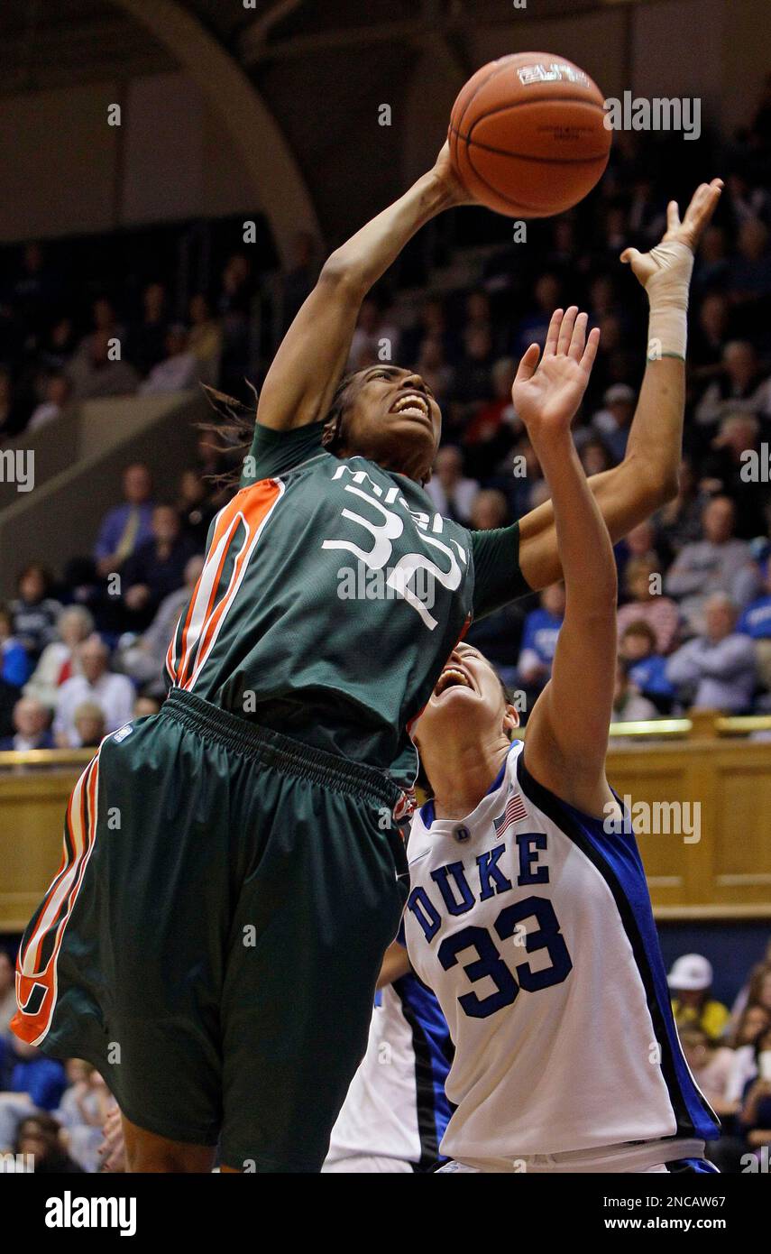 Miami's Morgan Stroman (32) reaches for the ball over Duke's Haley ...