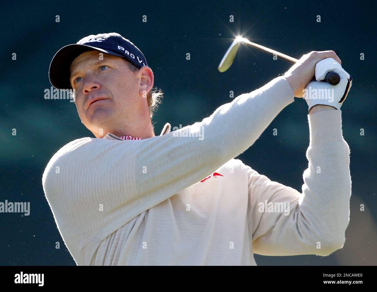 Tom Gillis watches his tee shot at the 16th hole during the first round ...