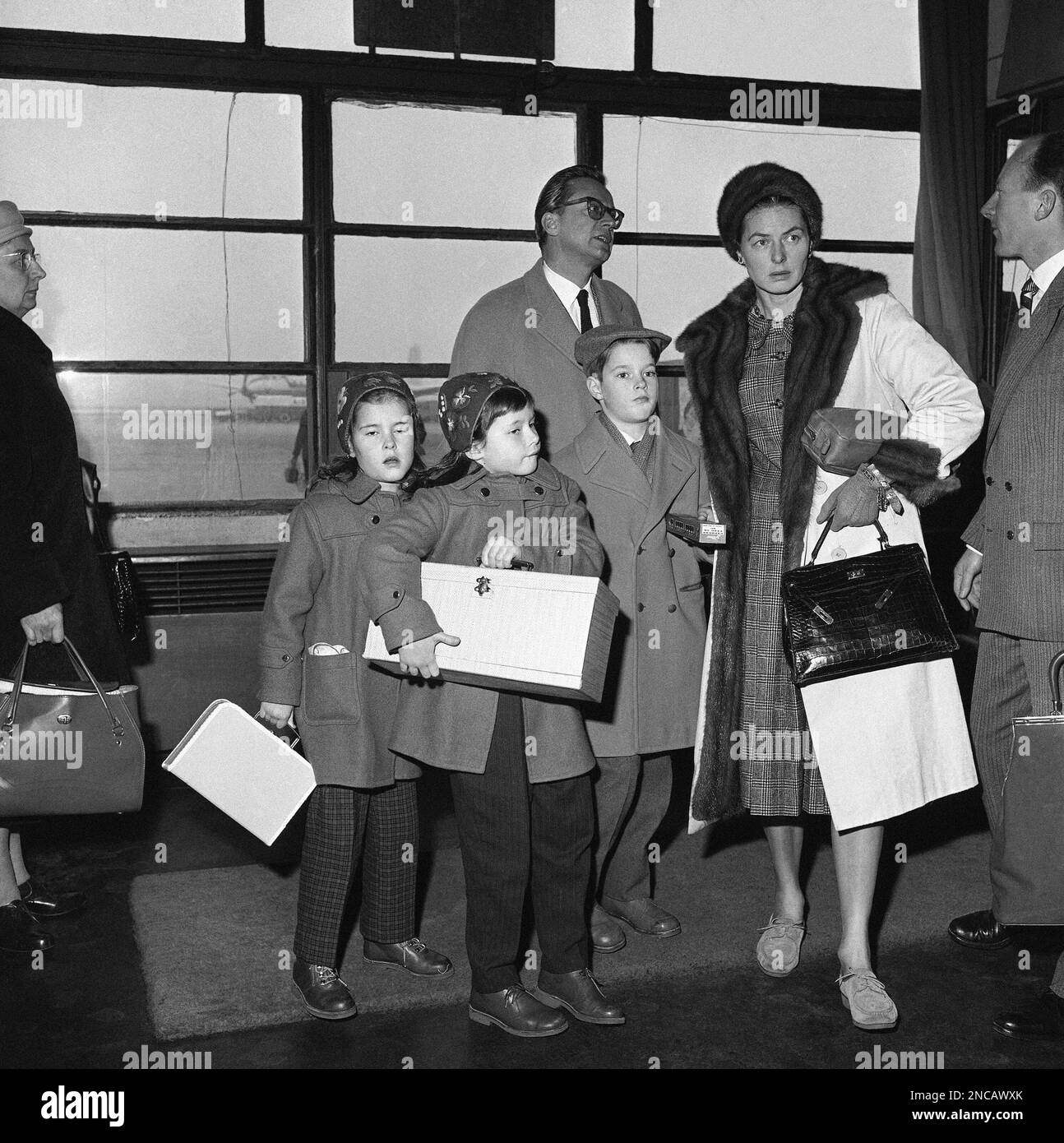 Actress Ingrid Bergman, her three children and her husband Lars Schmidt ...