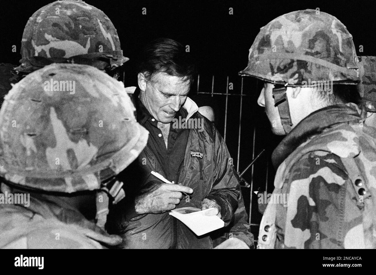 American actor Charlton Heston signs his autograph for three U.S ...