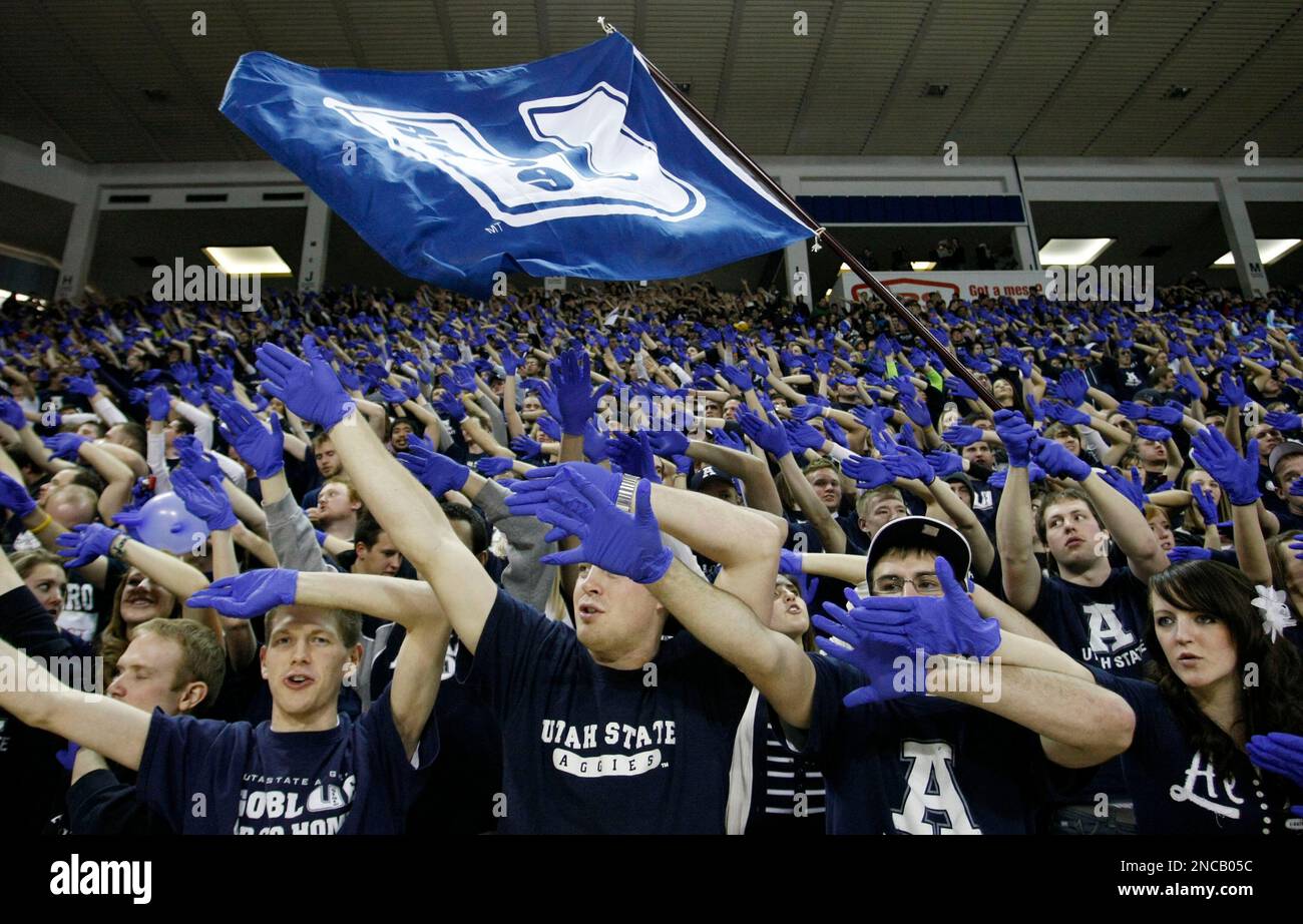 Utah State fans wear blue gloves as they chant before Utah State's NCAA ...