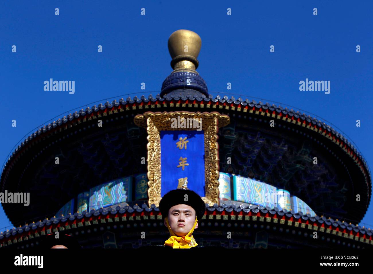A performer playing the role of emperor takes part in a reenactment of ...
