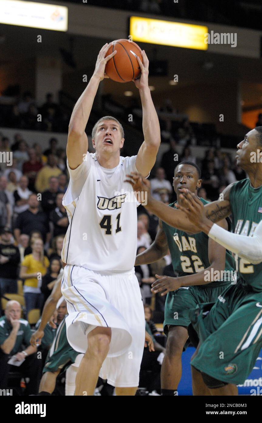 Central Florida center Tom Herzog, left, goes up for a shot in front of ...
