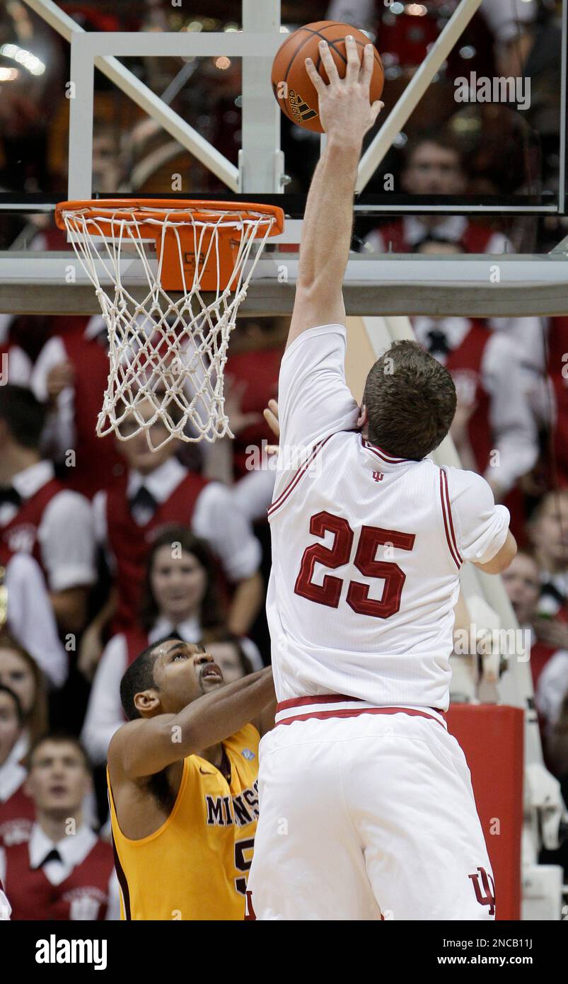 Indiana forward Tom Pritchard (25) dunks over Minnesota center Ralph ...