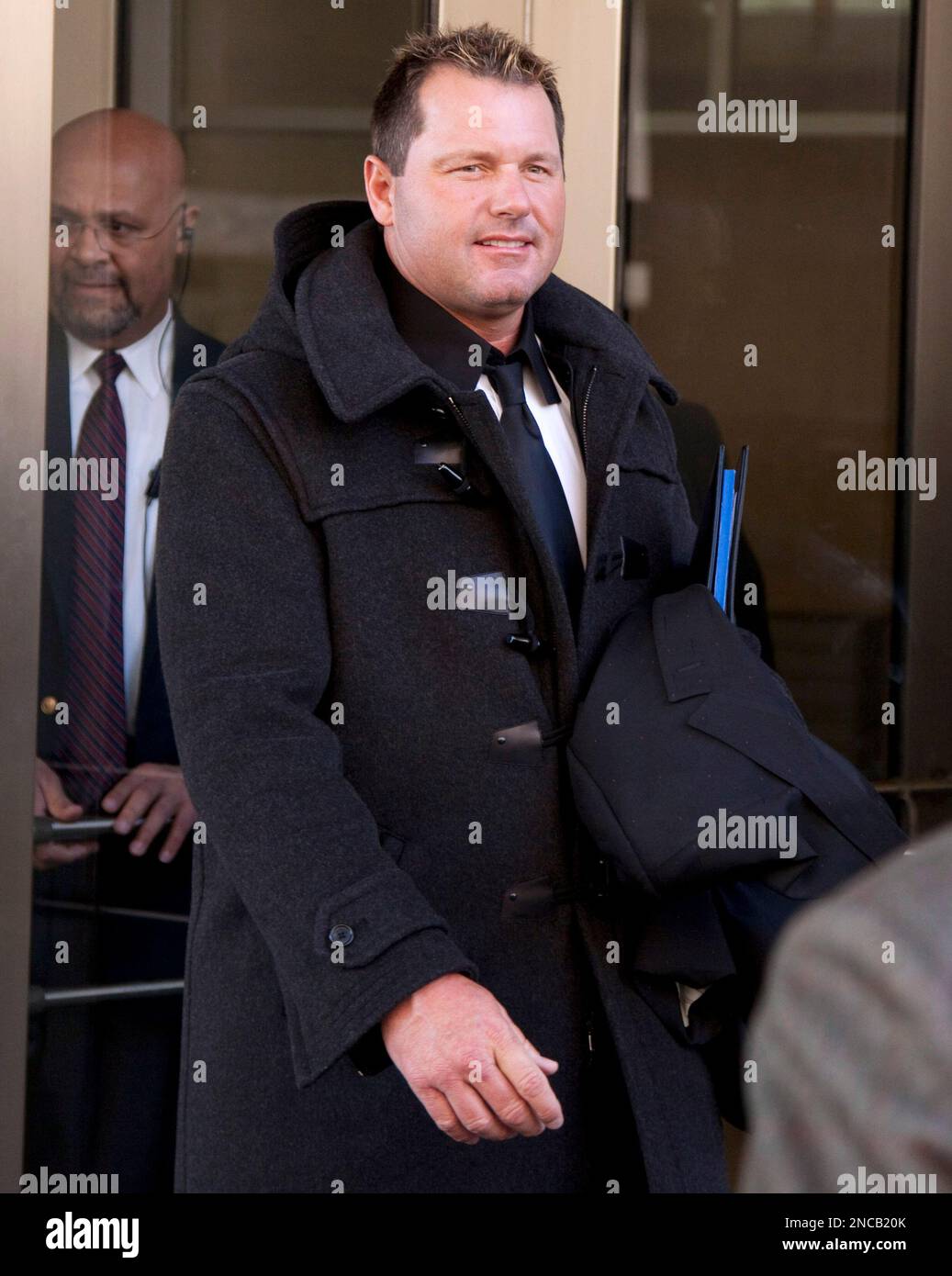 Former Major League Baseball pitcher Roger Clemens leaves the federal ...